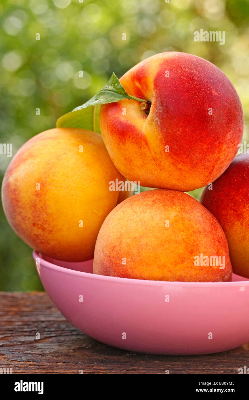 Peaches in natural background Stock Photo - Alamy
