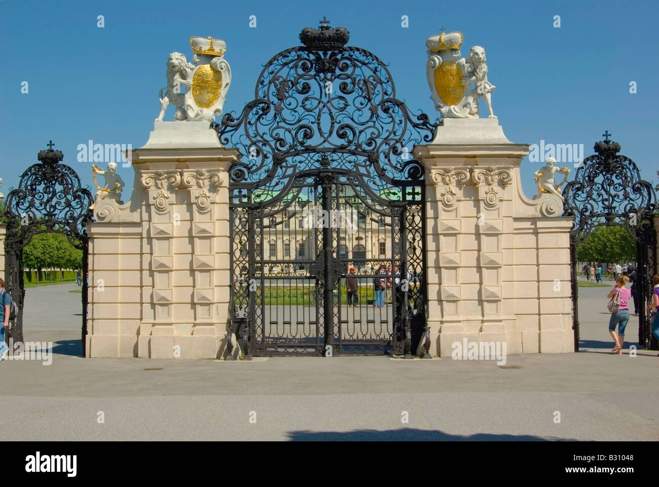 Decorated entrance gate leading to baroque Belvedere Palace and gardens ...