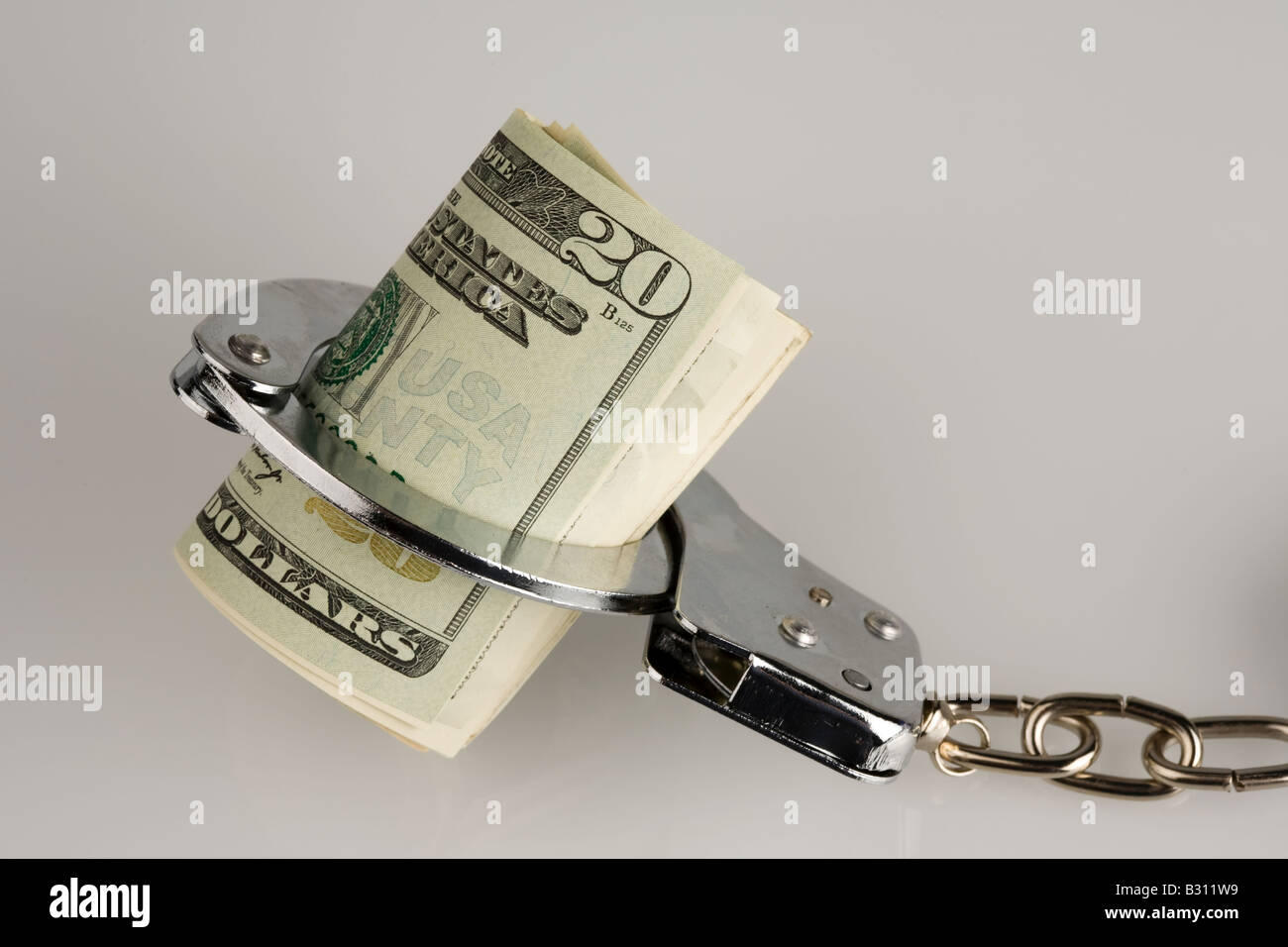 Dollar banknotes and handcuffs Stock Photo - Alamy