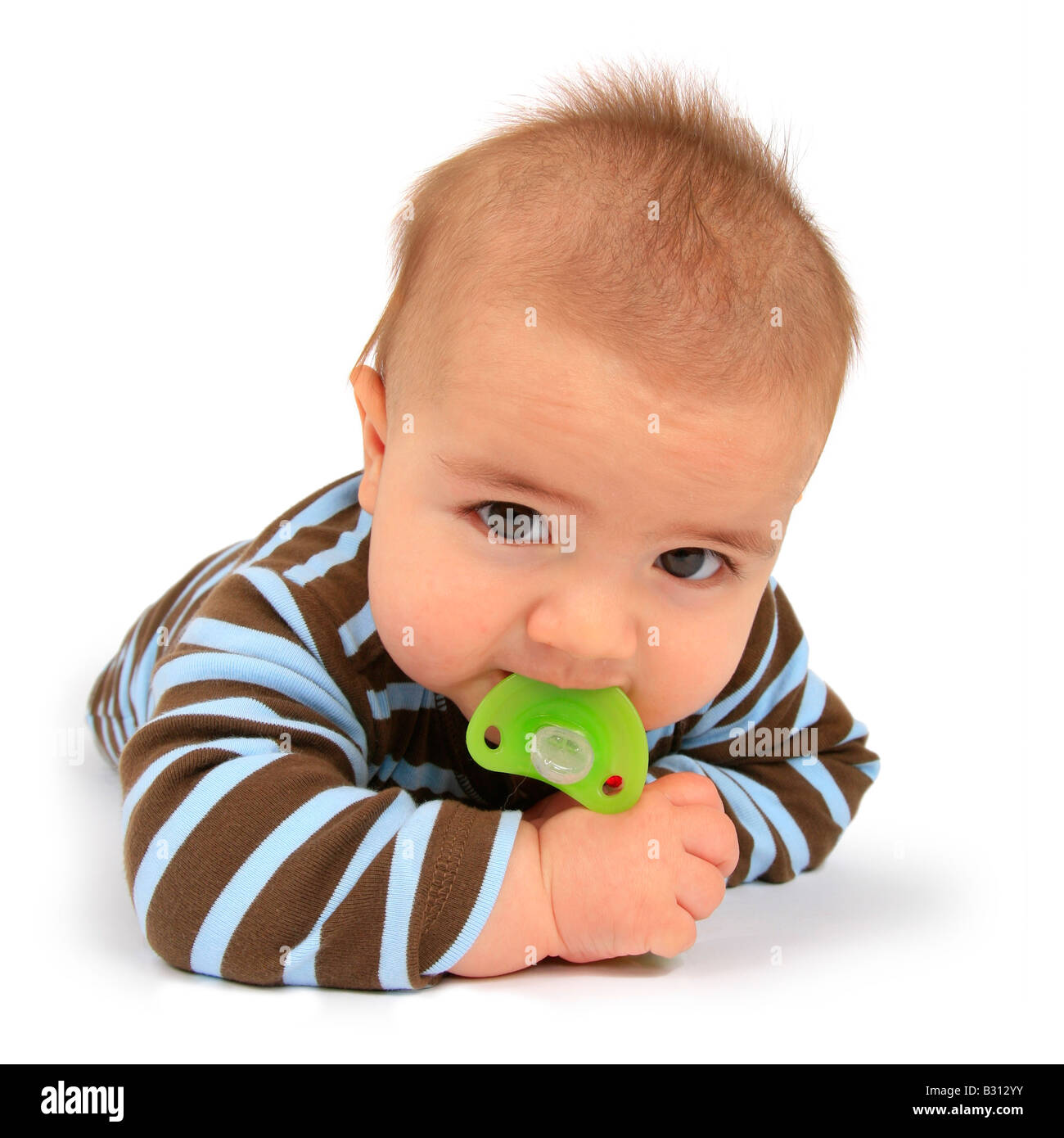 baby with comforter lying on its belly Stock Photo - Alamy