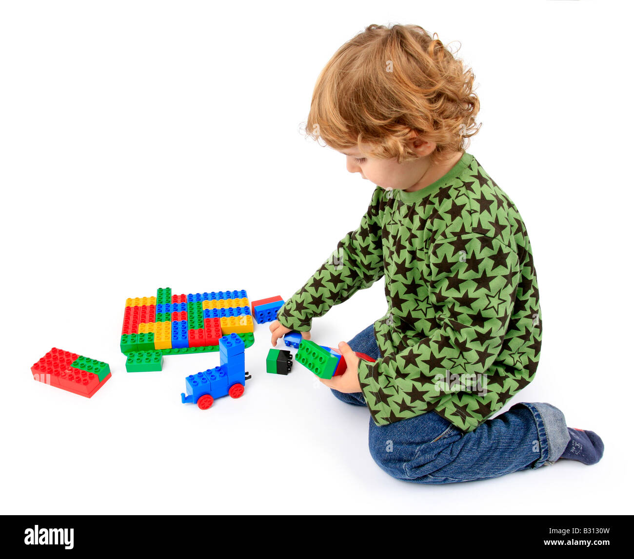 little boy playing with Lego bricks Stock Photo - Alamy