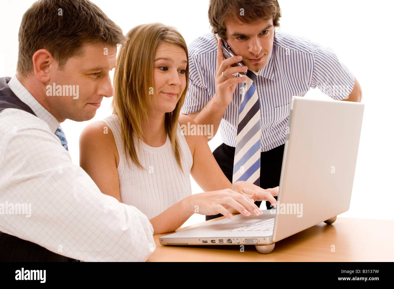 Business team of 3 with laptops hi-res stock photography and images - Alamy