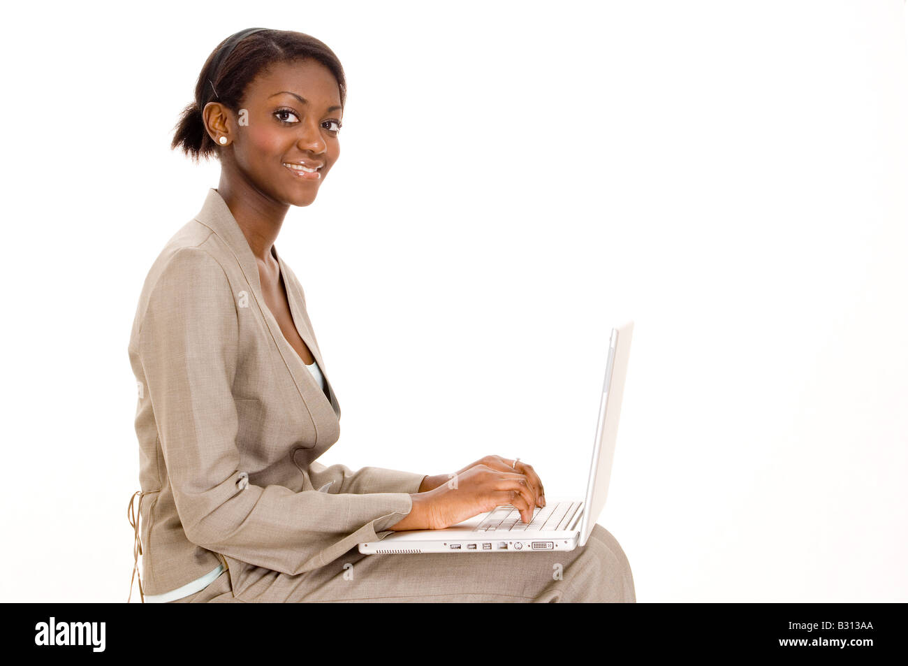 a happy young black woman using a laptop computer Stock Photo - Alamy