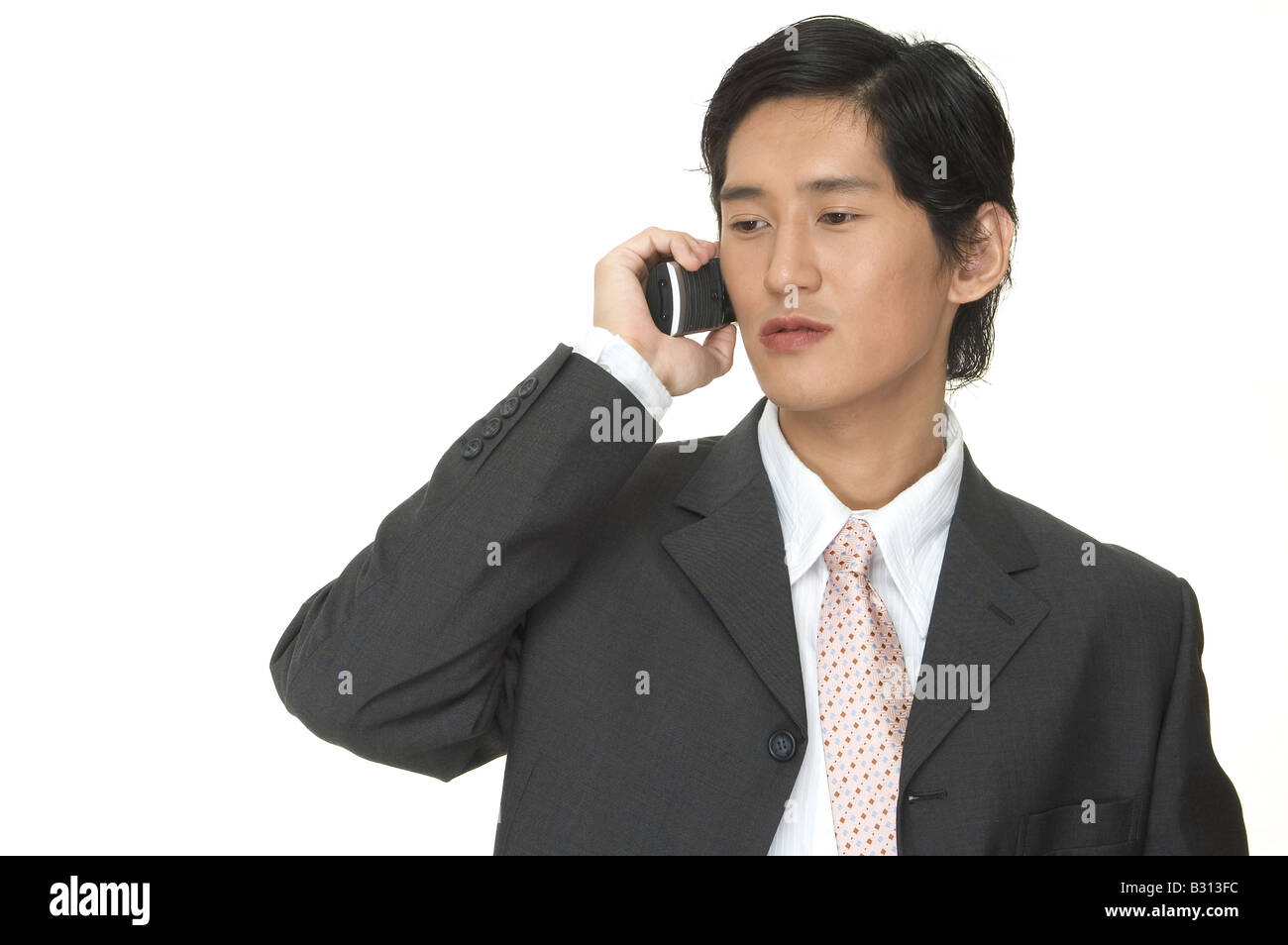 An asian businessman makes an important business phone call Stock Photo ...
