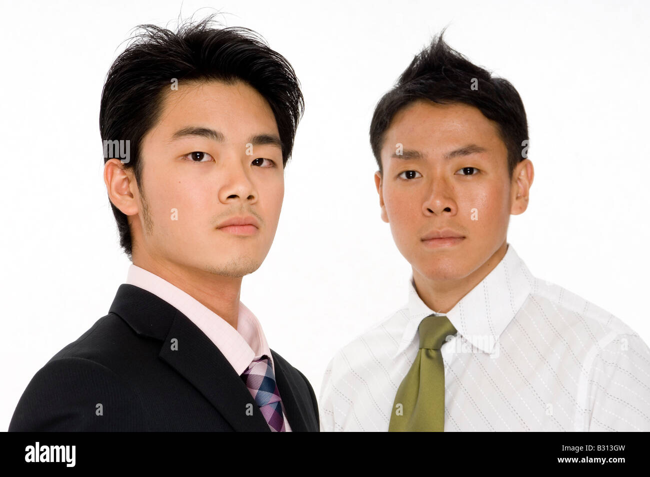 Two young fashionable businessmen, one in jacket and one in shirt Stock ...