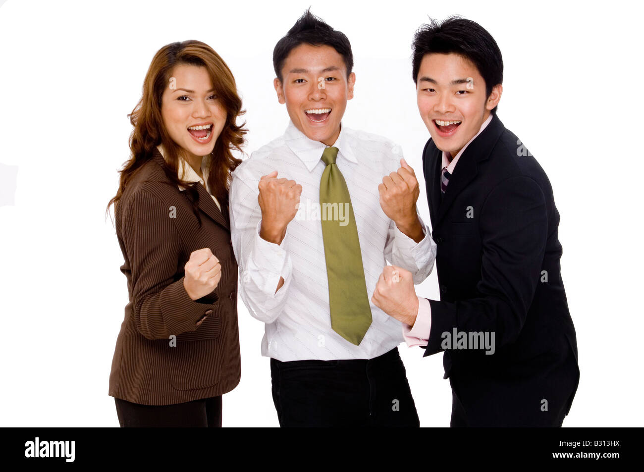 Three young executives punch the air in celebration Stock Photo - Alamy