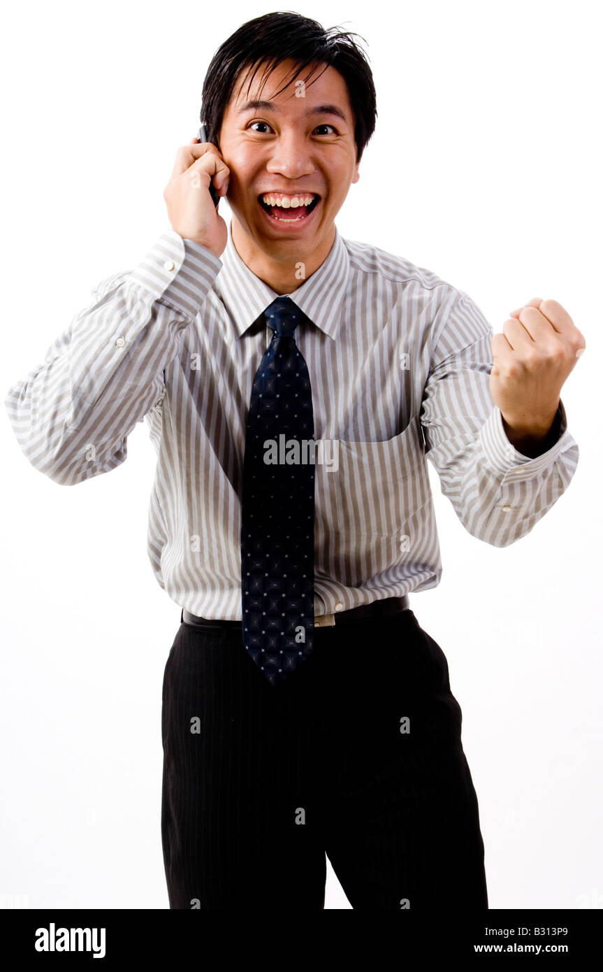 A young asian businessman smiles as he makes a deal Stock Photo - Alamy