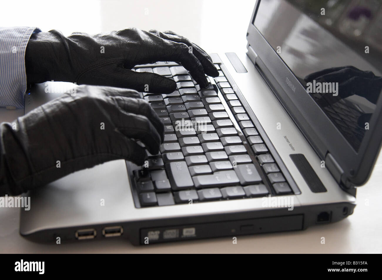gloved hands at the laptop Stock Photo - Alamy