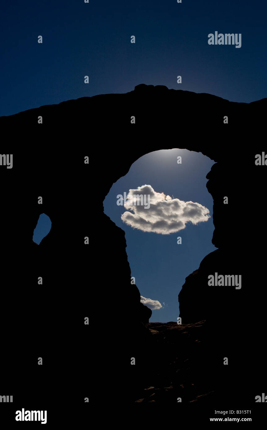 Portrait format colour picture a single cloud framed in similarly ...