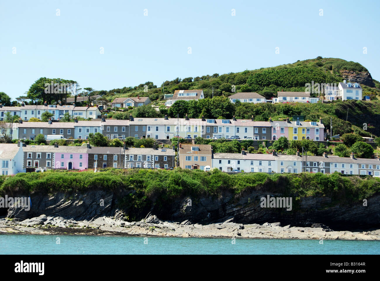 Rows of pastel coloured houses at New Quay what Dylan Thomas called the ...
