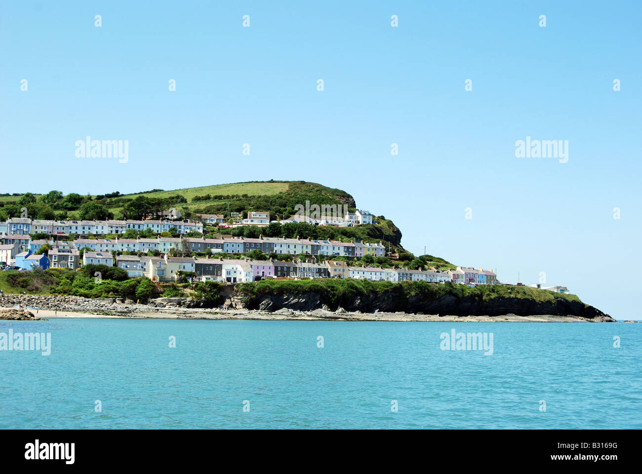 Rows of pastel coloured houses at New Quay what Dylan Thomas called the ...