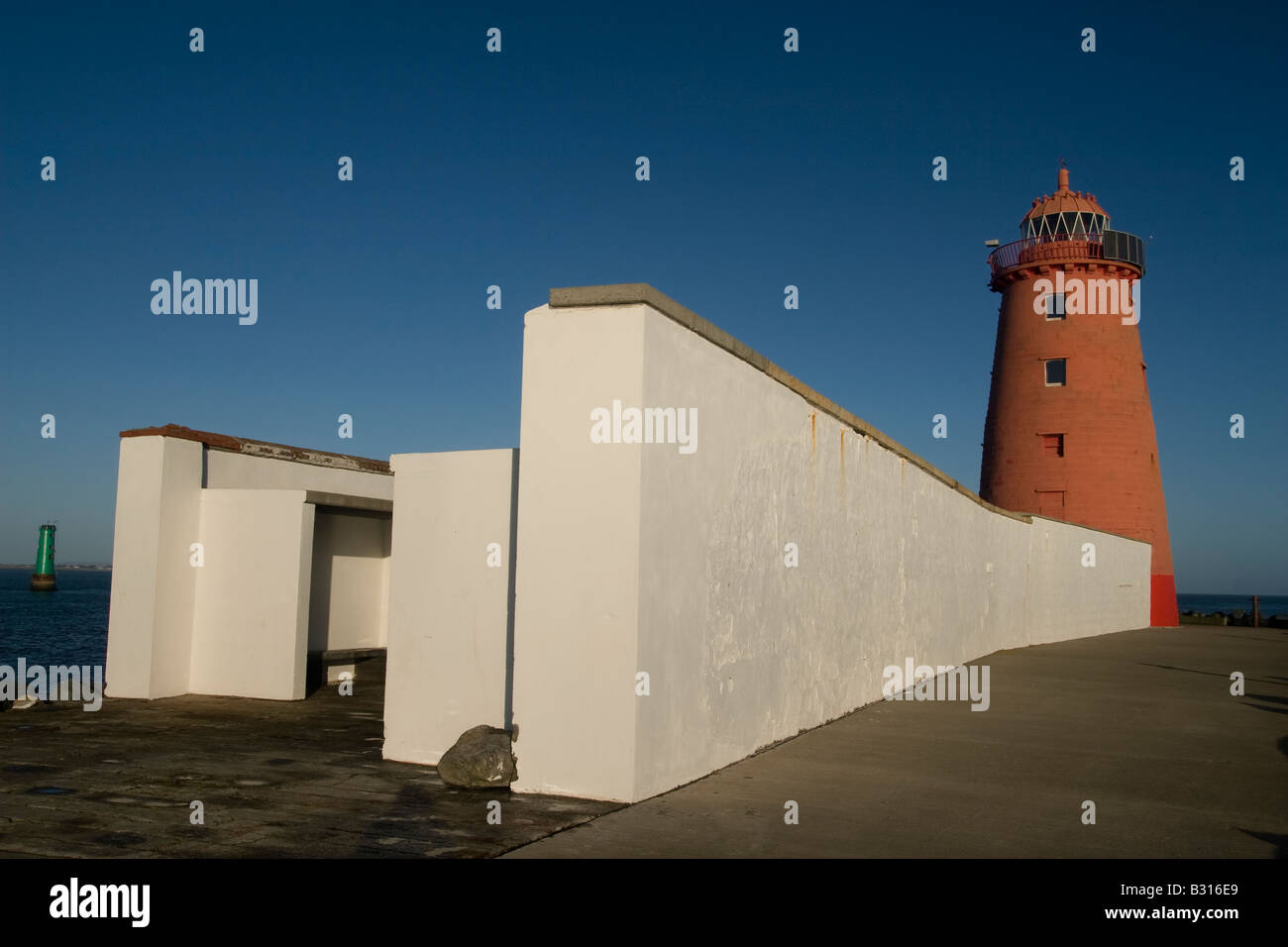 Poolbeg Lighthouse at sunset with a clear blue sky Stock Photo - Alamy