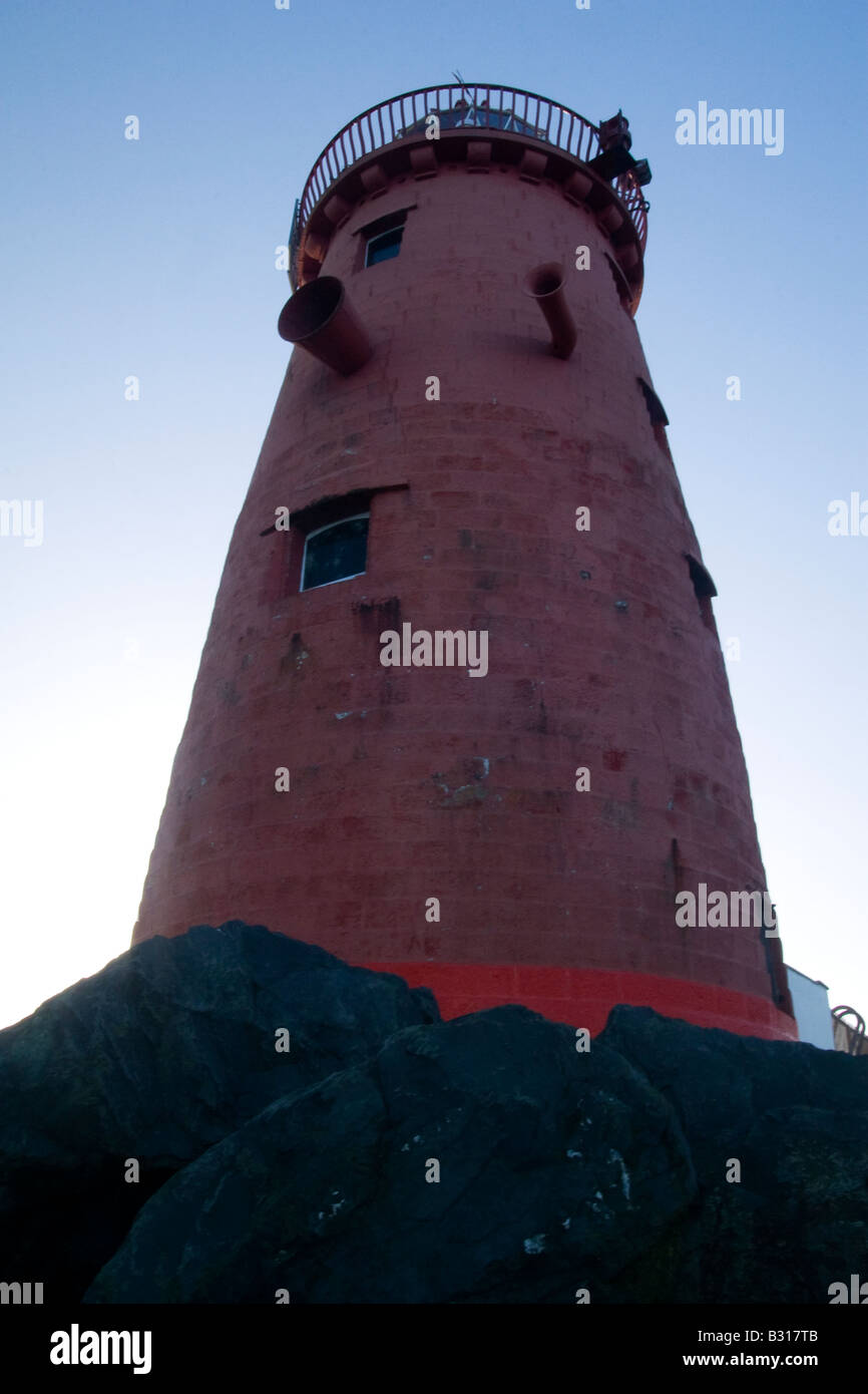 Poolbeg Lighthouse at sunset with a clear blue sky Stock Photo - Alamy