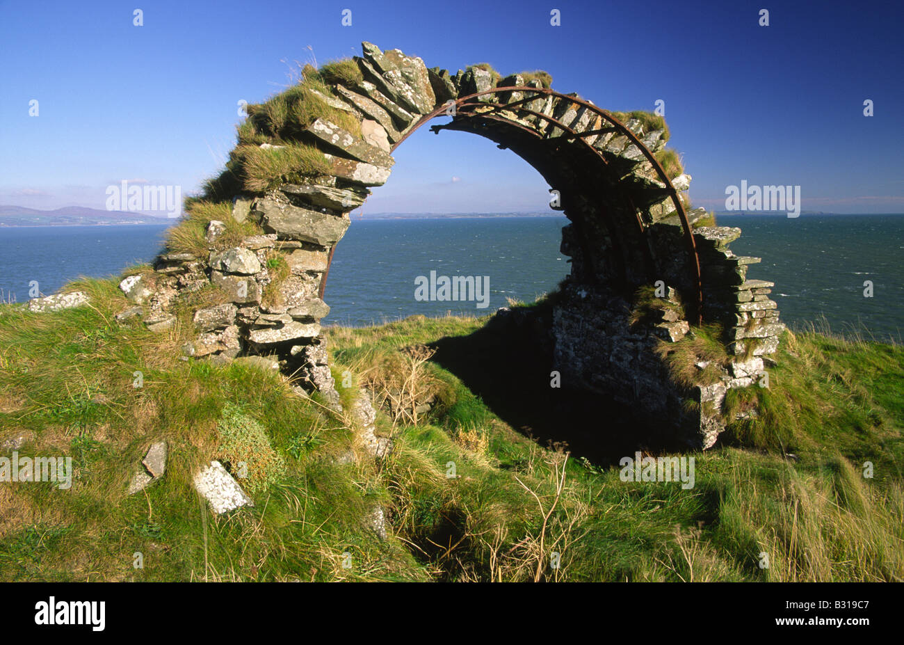 Scottish castle on cliff top ruin of Cruggleton Castle arch of cellar ...