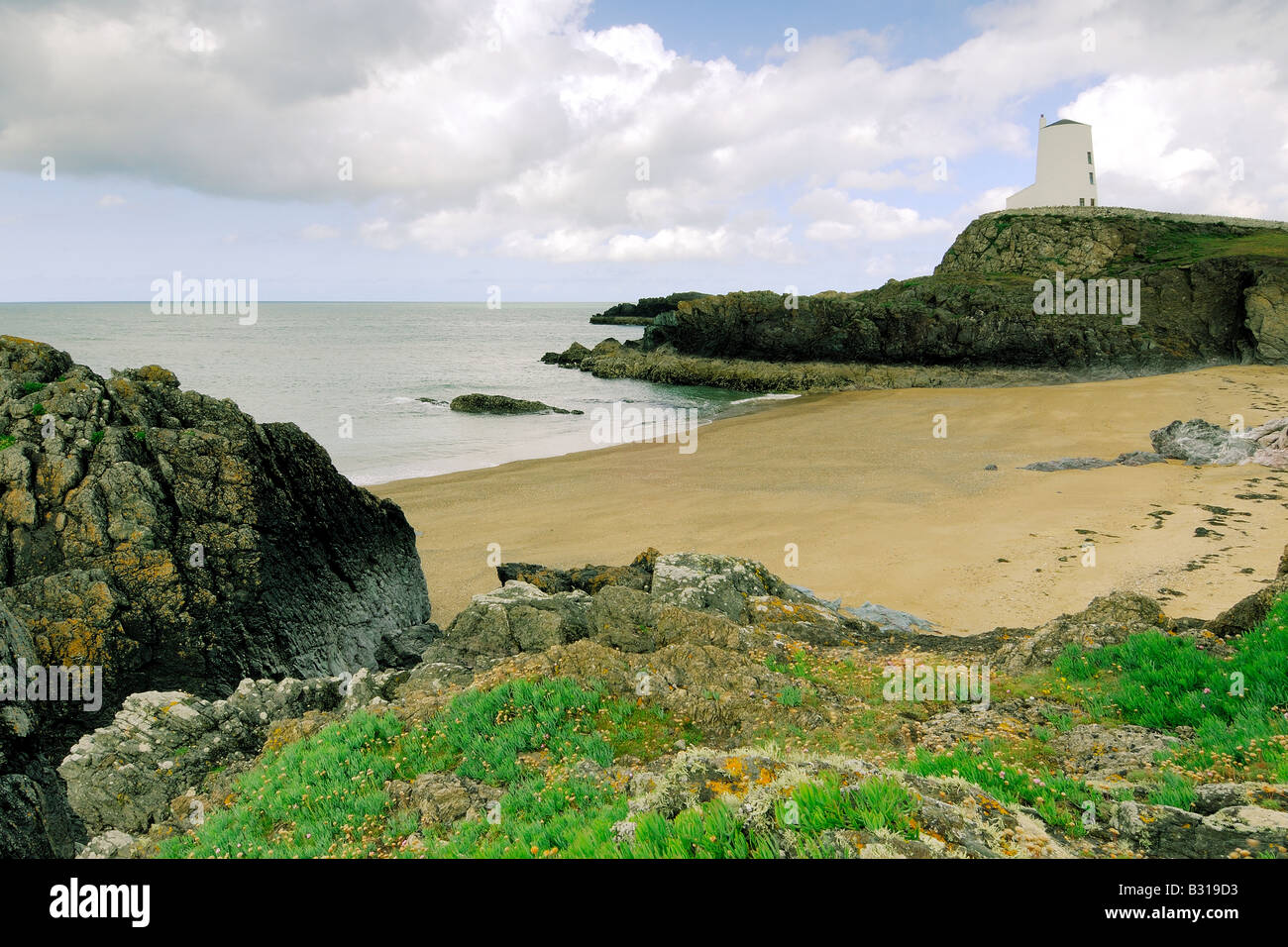 Lighthouse at Porth Twr Mawr on Llanddwyn Island off the coast of ...
