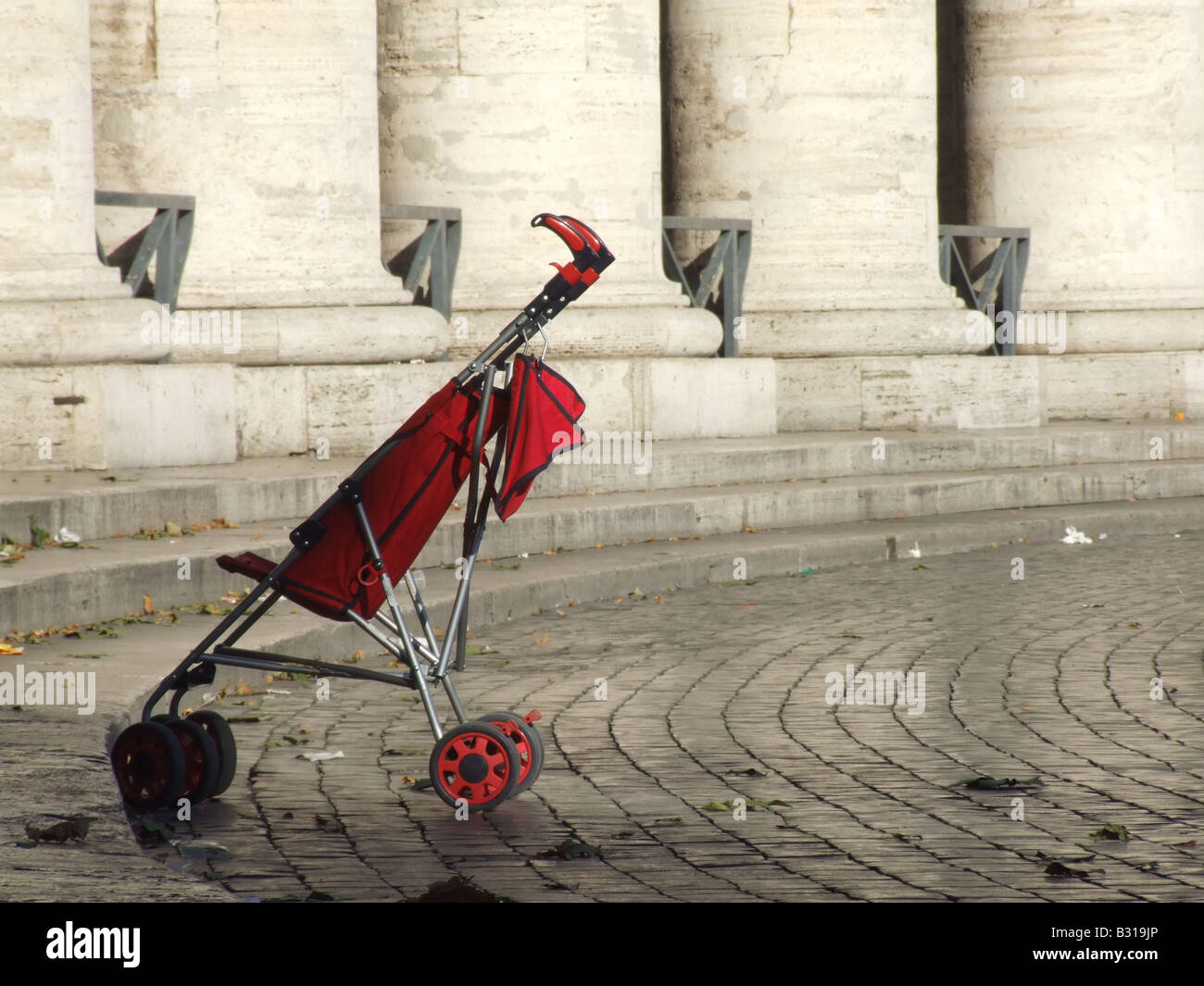 one empty red pram in the vatican square, rome Stock Photo - Alamy
