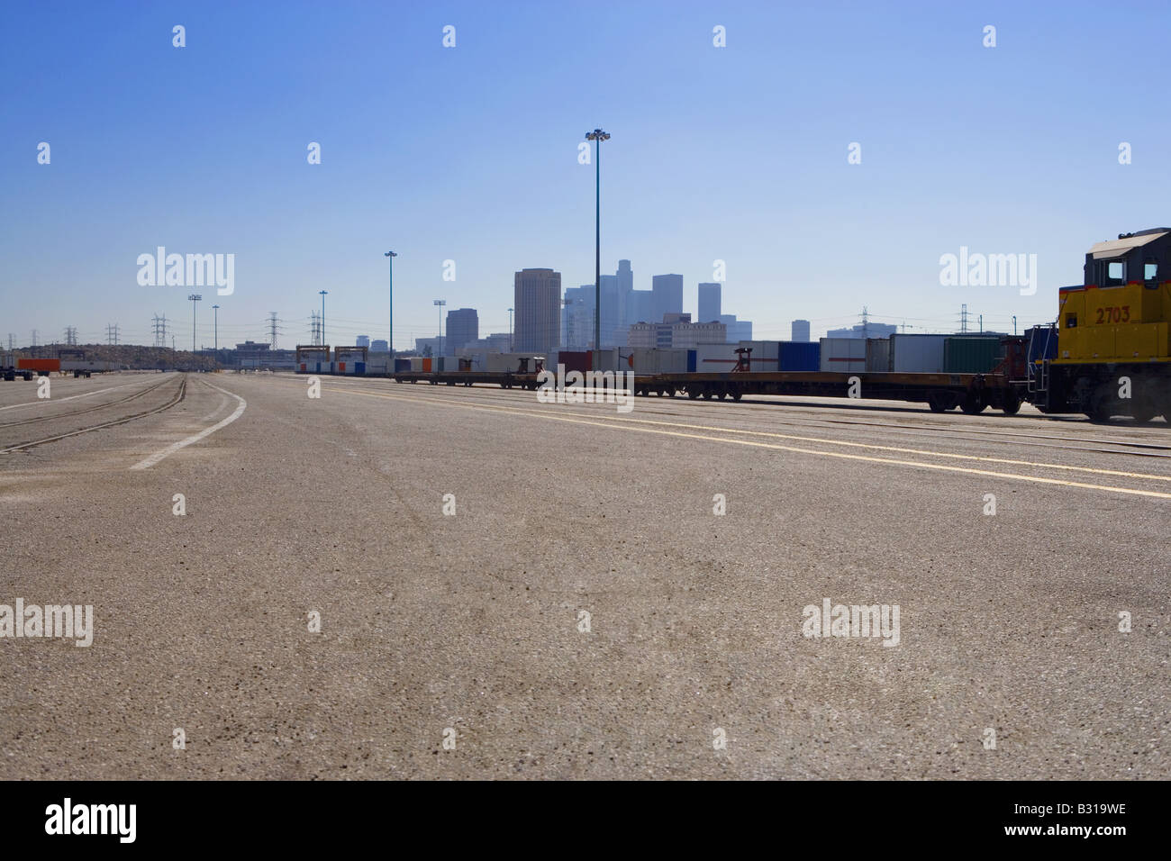 Vehicle hauling container at terminal Stock Photo - Alamy