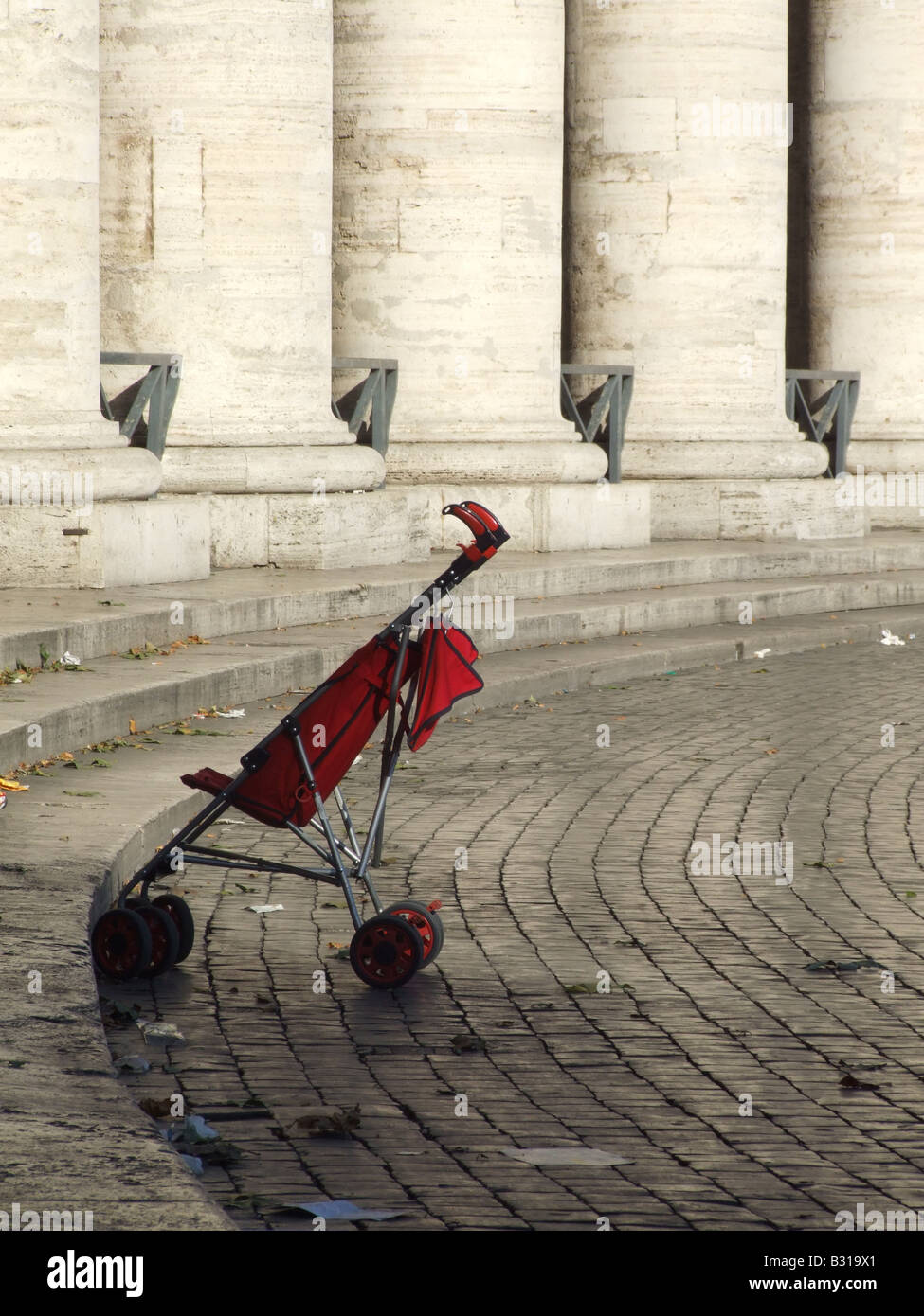 one empty red pram in the vatican square, rome Stock Photo - Alamy