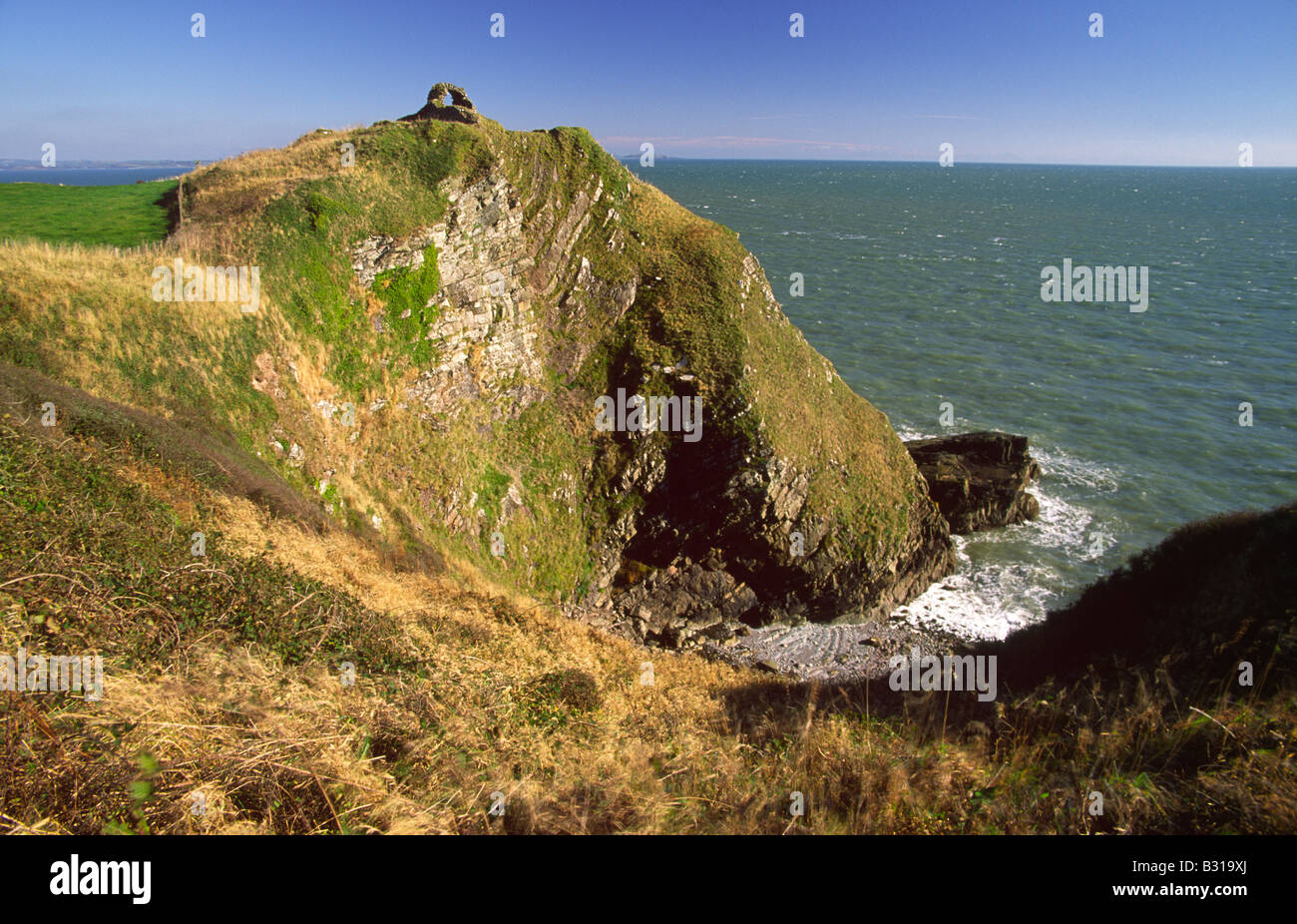 Scottish castle Cruggleton Castle on cliff top promontory looking out ...