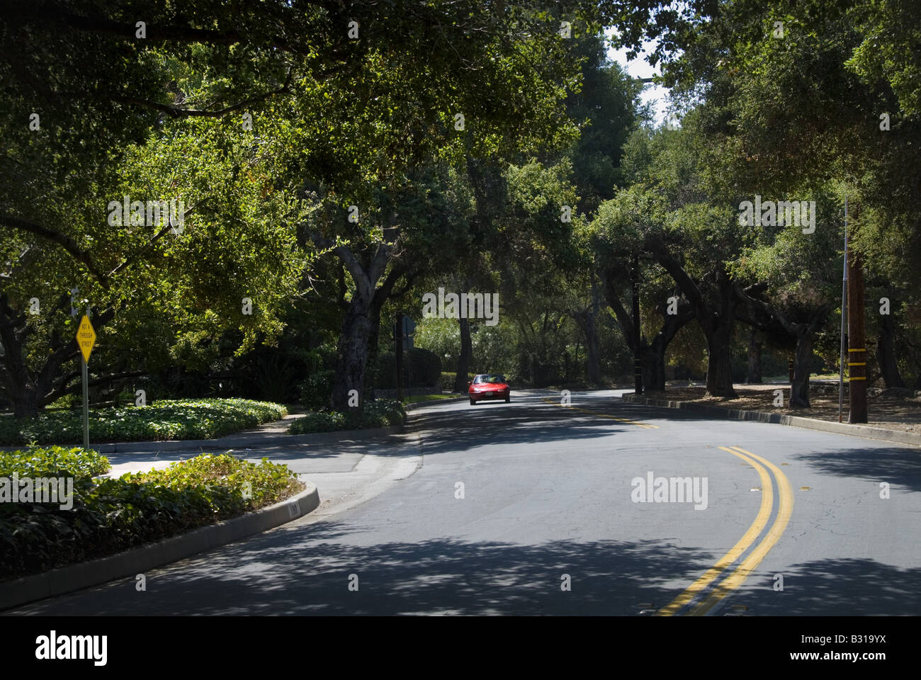 Curved road in neighborhood Stock Photo - Alamy