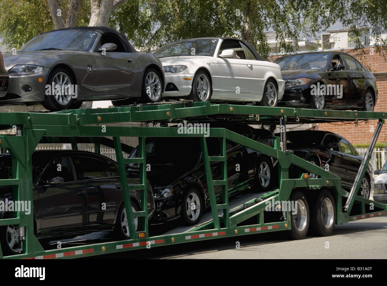 Trailer loaded with cars Stock Photo - Alamy