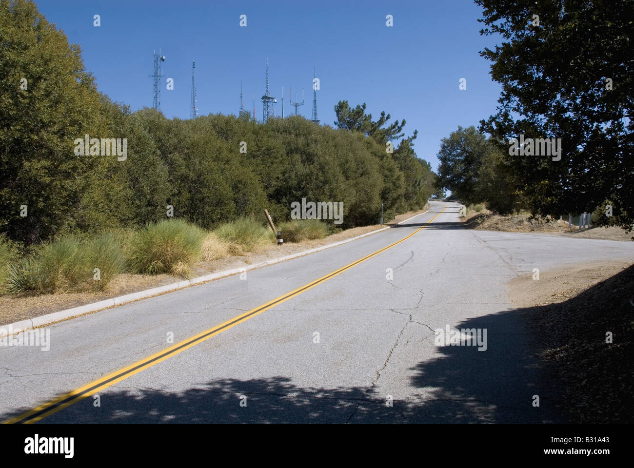 Cell phone towers along rural road Stock Photo - Alamy
