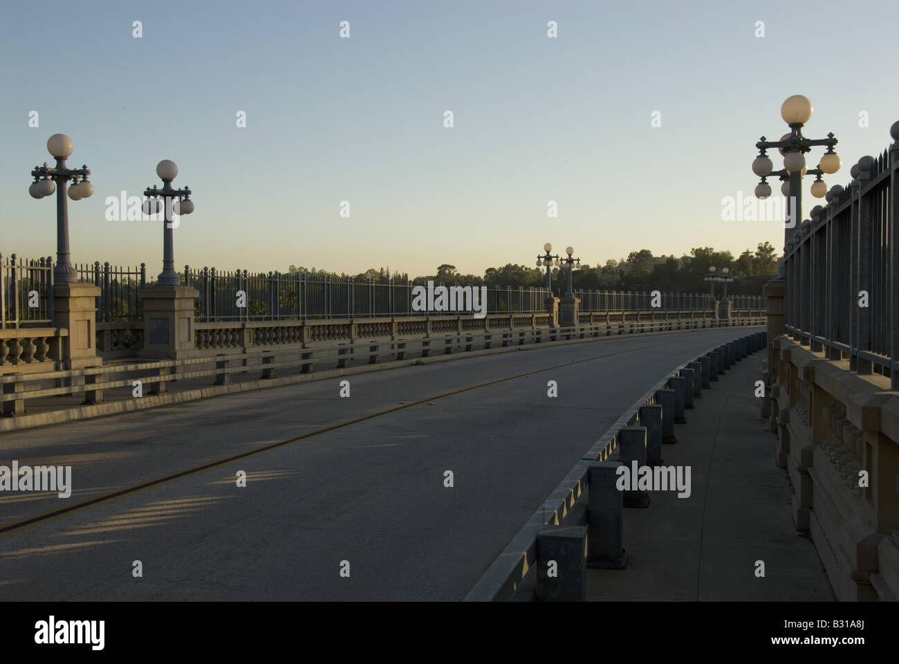 Street lights along street, over bridge Stock Photo - Alamy