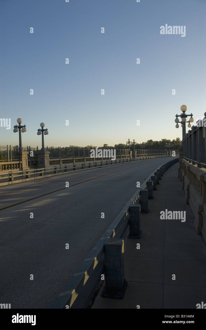 Street lights along street, over bridge Stock Photo - Alamy