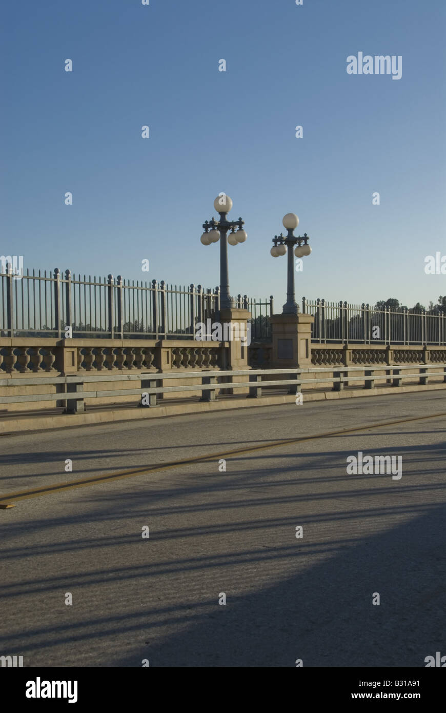 Street lights along street, over bridge Stock Photo - Alamy