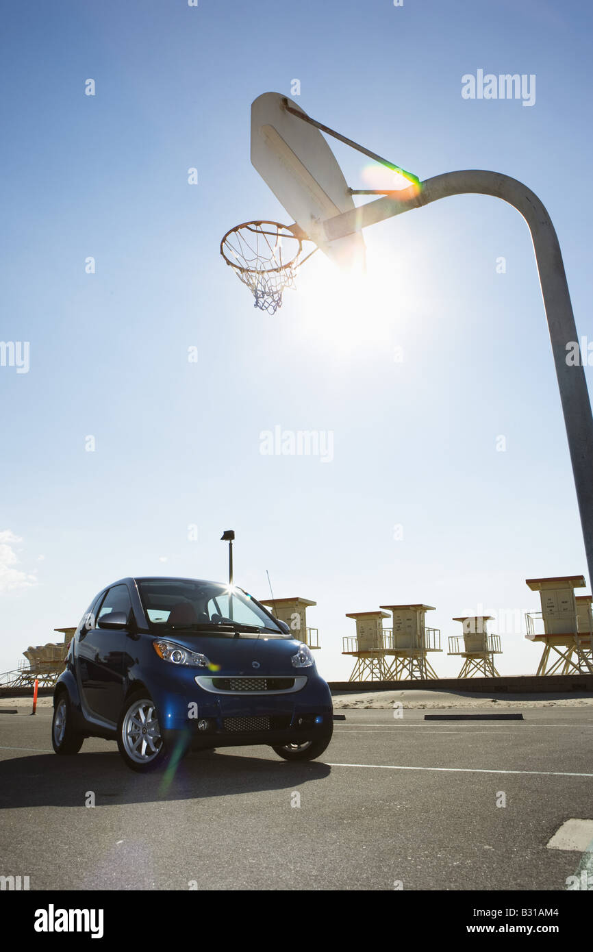 Smartcar parked on basketball court at beach Stock Photo - Alamy
