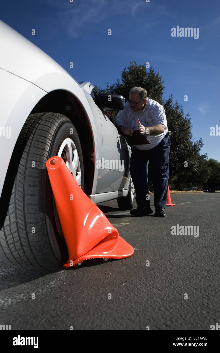 Close up of cone crushed by teen driver Stock Photo - Alamy