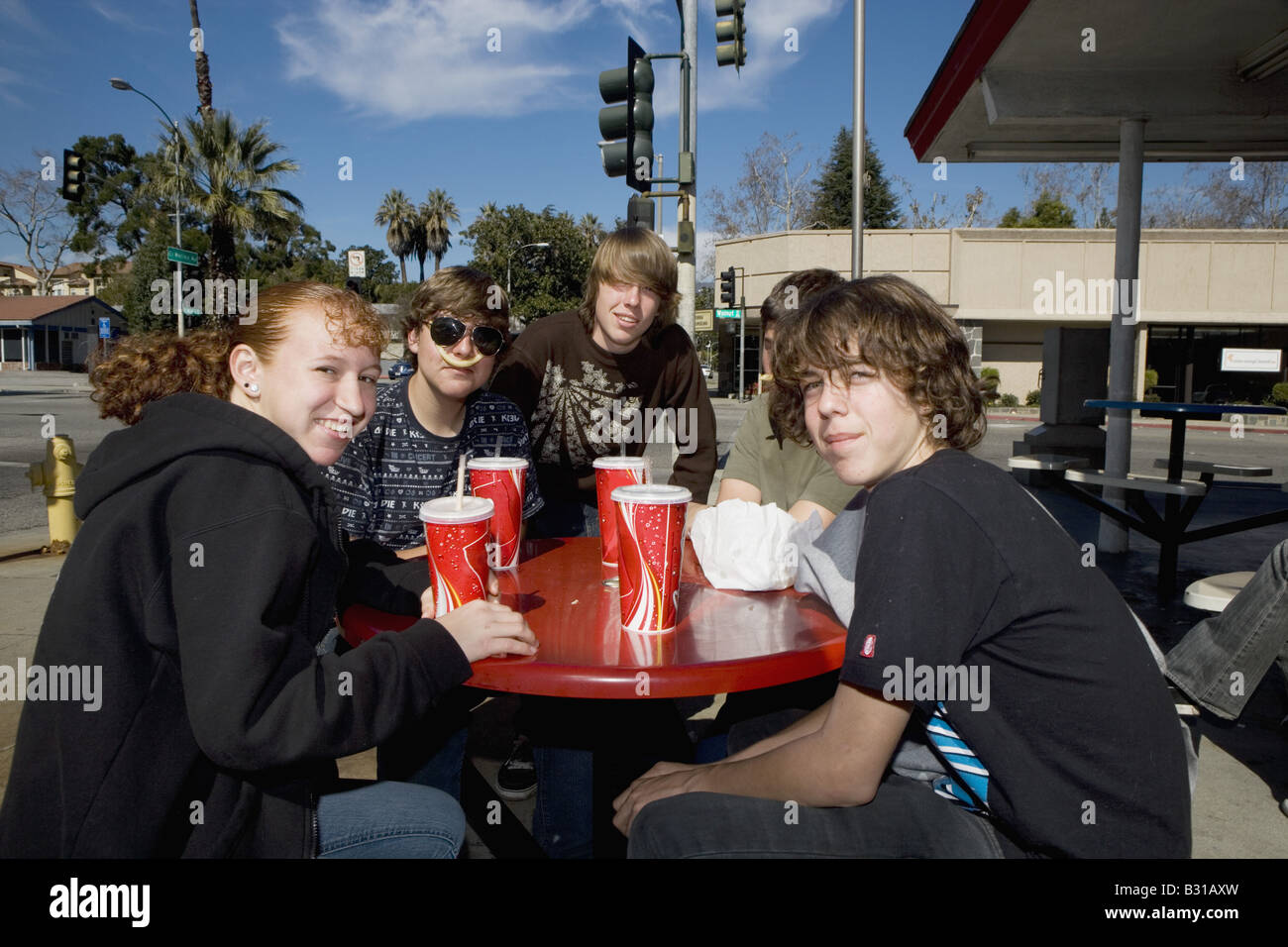 Group of teens at fast food restaurant Stock Photo - Alamy