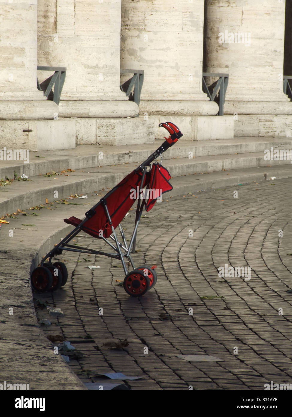 one empty red pram in the vatican square, rome Stock Photo - Alamy