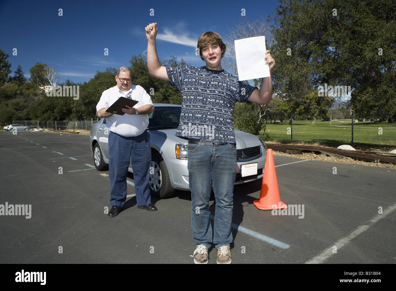 Teen boy passes driving test Stock Photo - Alamy