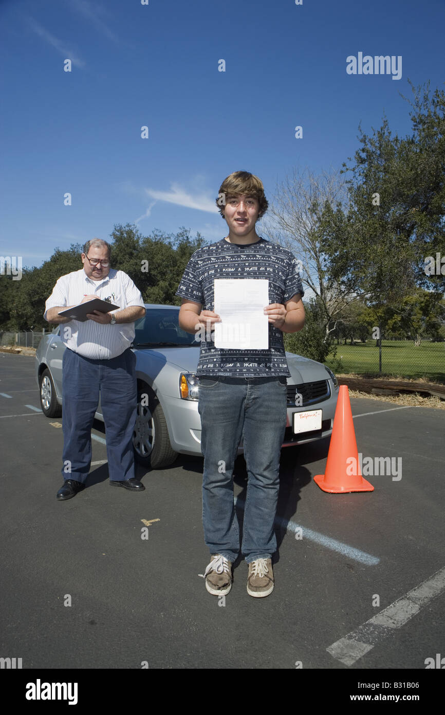 Teen boy passes driving test Stock Photo - Alamy