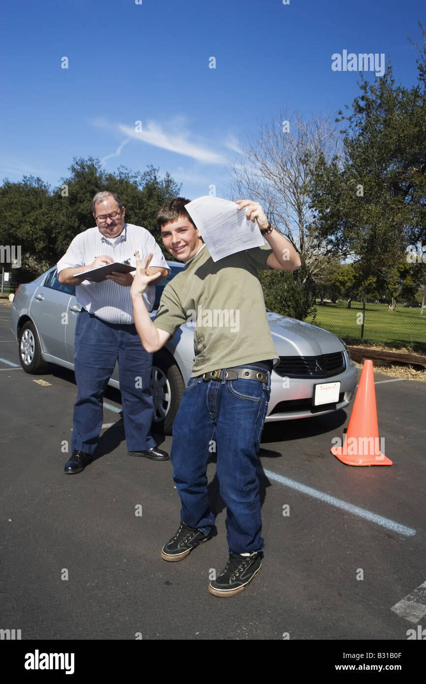 Teen boy passes driving test Stock Photo - Alamy