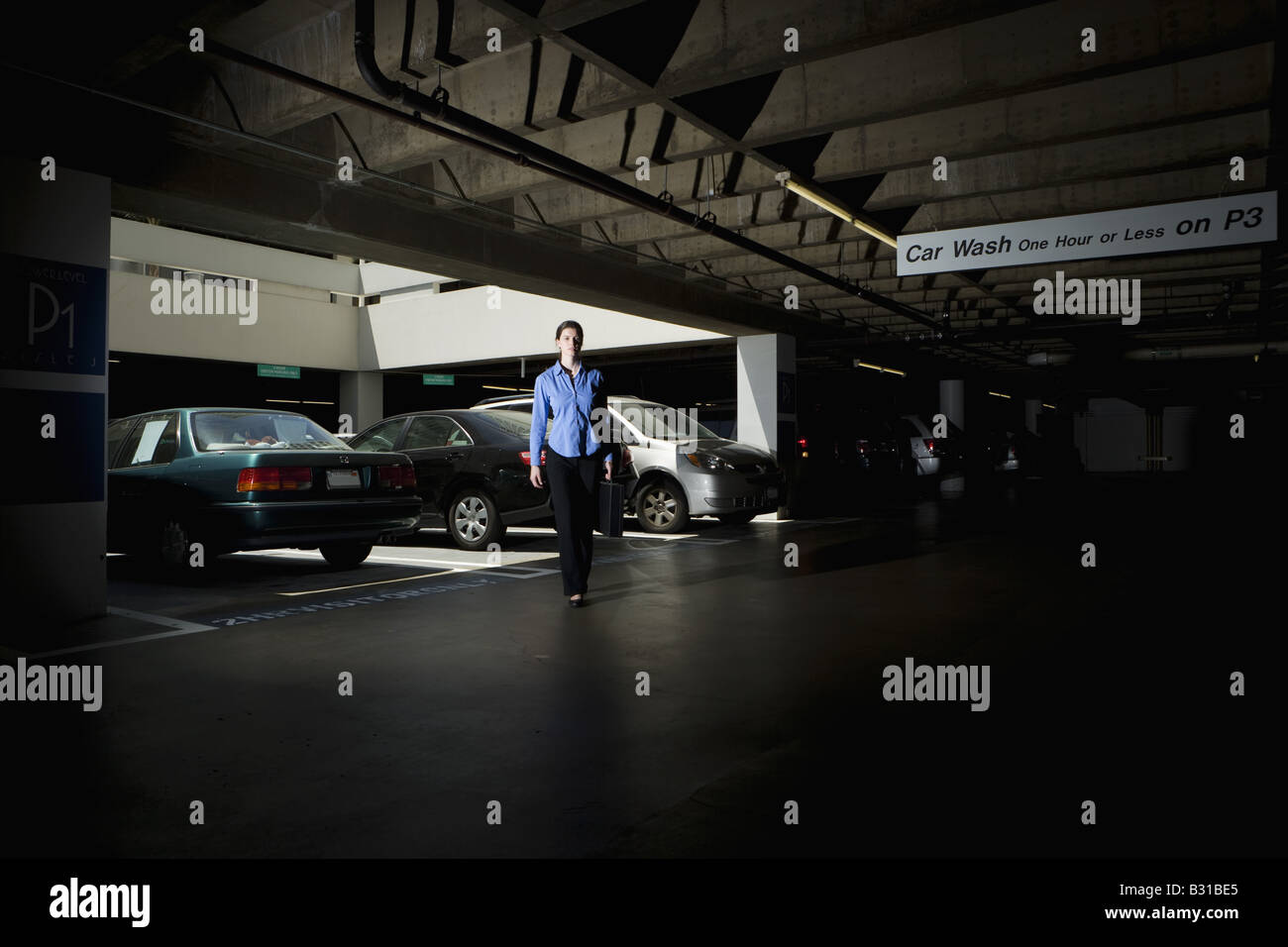 Woman walking to car hi-res stock photography and images - Alamy