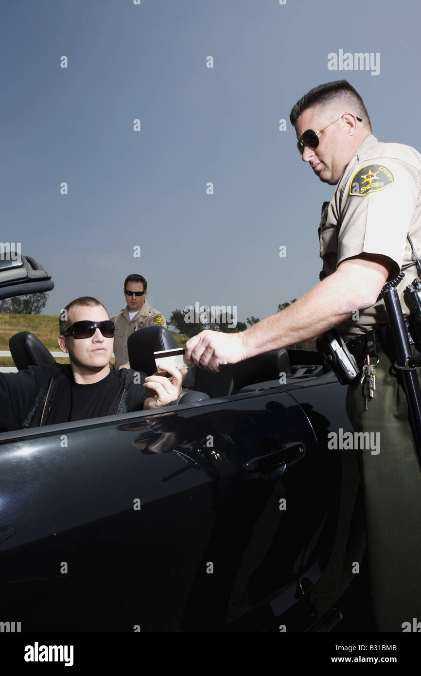 Police handing hi-res stock photography and images - Alamy