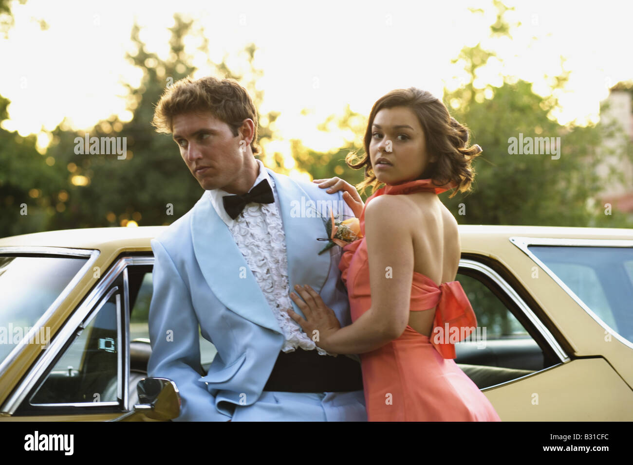 Young couple by car going to prom Stock Photo - Alamy