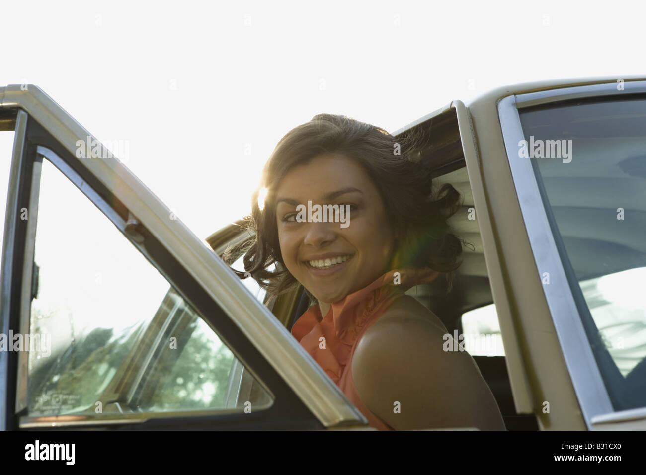Young woman getting out of car Stock Photo - Alamy Young woman getting out of car Stock Photo - Alamy