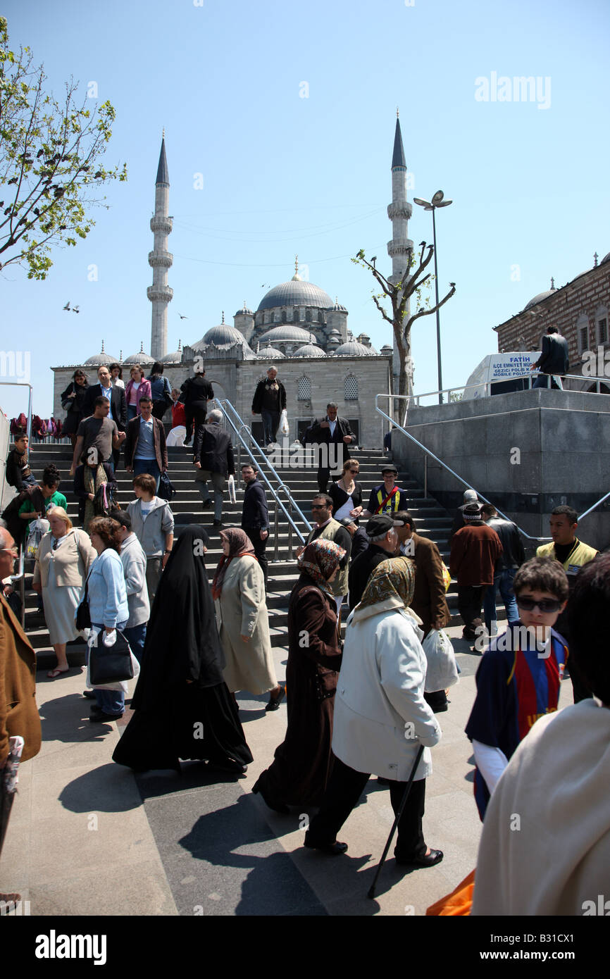 TUR Turkey Istanbul People in front of New Mosque Yeni Cami in Eminönü ...