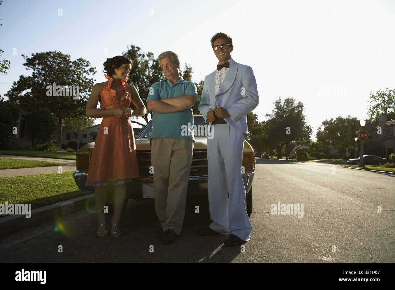 Father with prom couple Stock Photo - Alamy