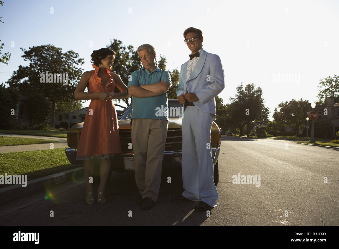 Father with prom couple Stock Photo - Alamy
