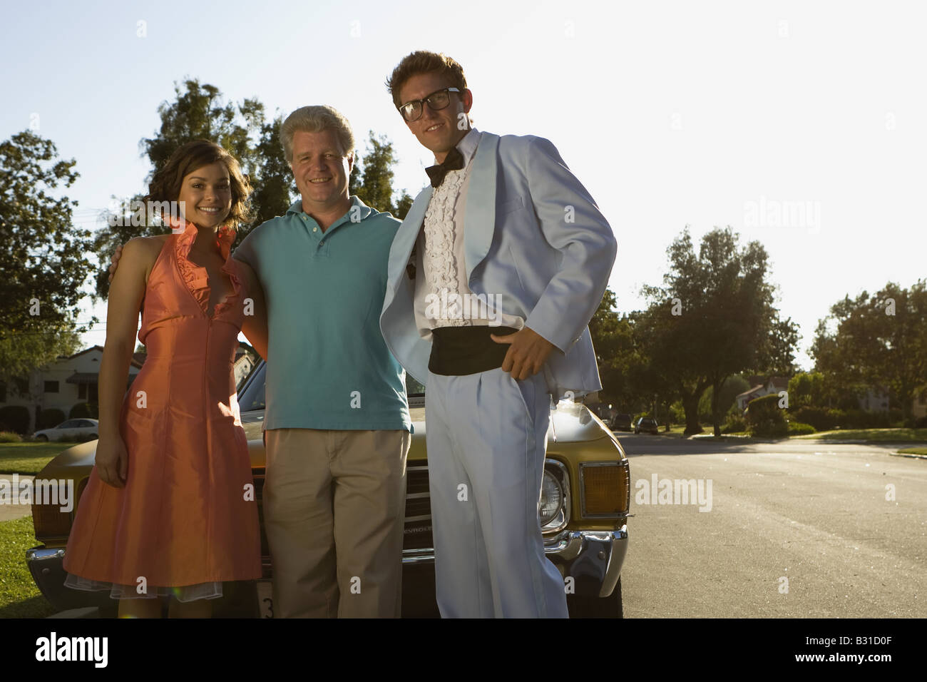 Father with prom couple Stock Photo - Alamy
