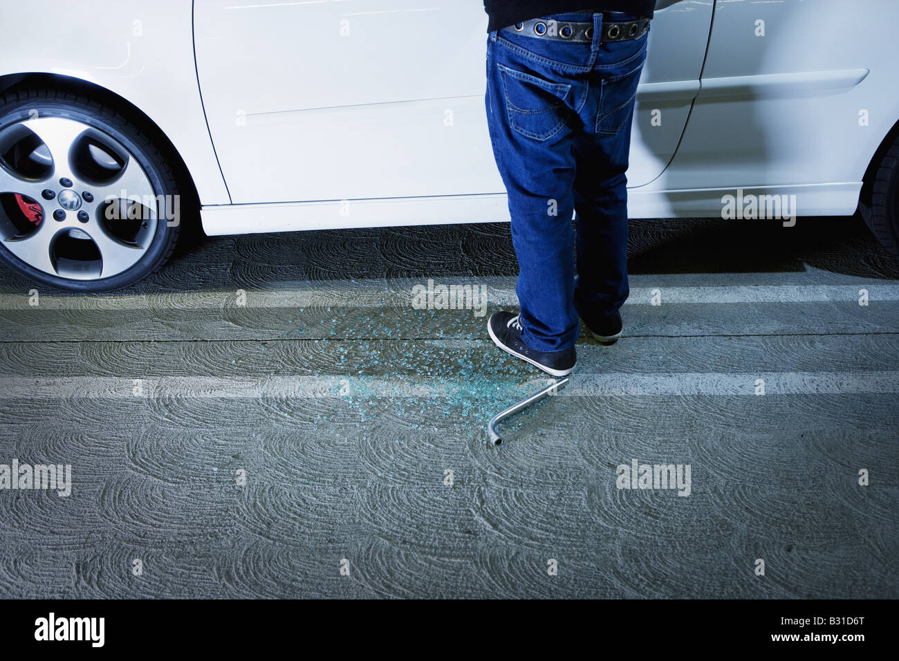 Thief breaking in white VW GTI Stock Photo - Alamy