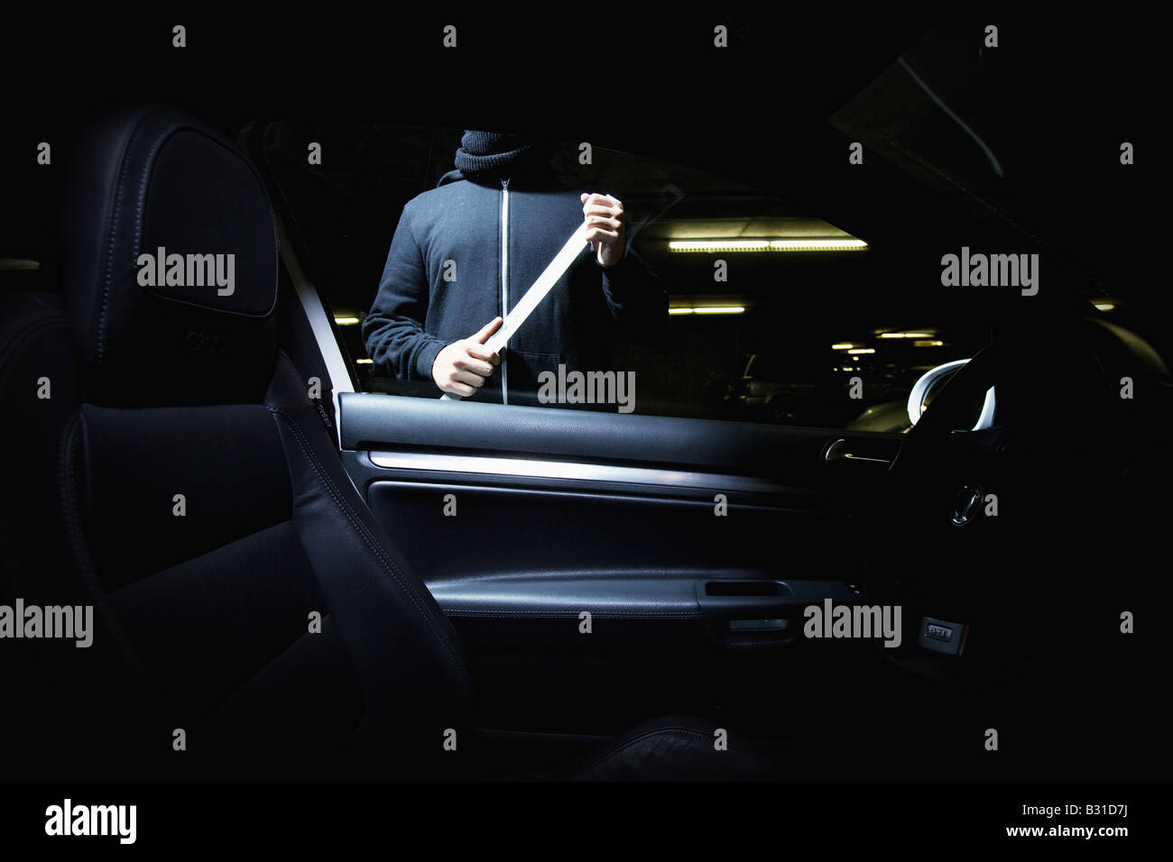 Interior view of thief breaking in car with Crowbar Stock Photo - Alamy