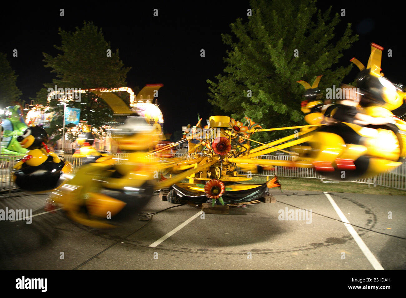 Large yellow and black bees children’s fairground ride. Bees rotating ...