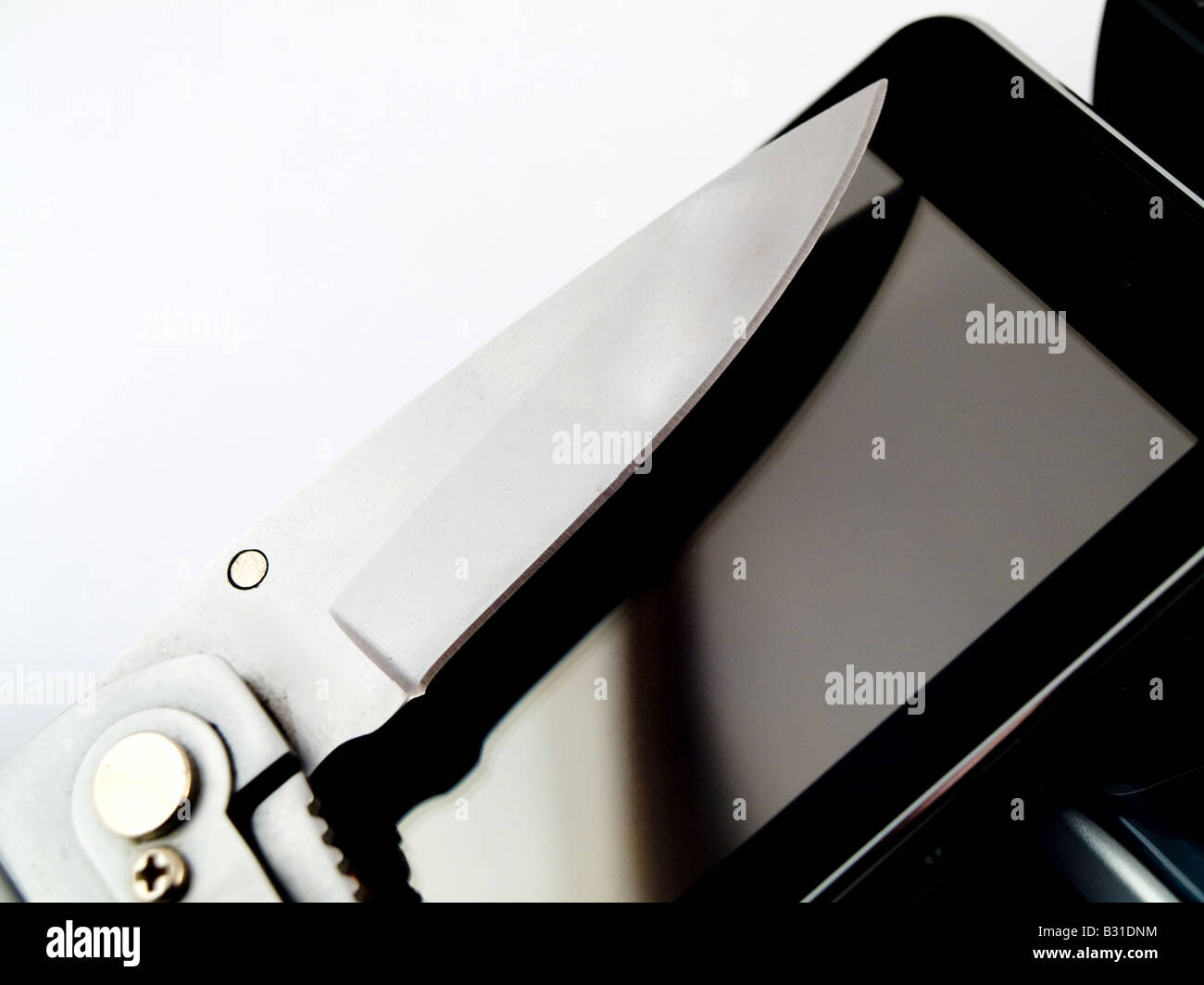 Modern Touchscreen Mobile Phone and Hunting Utility Knife Blade On ...