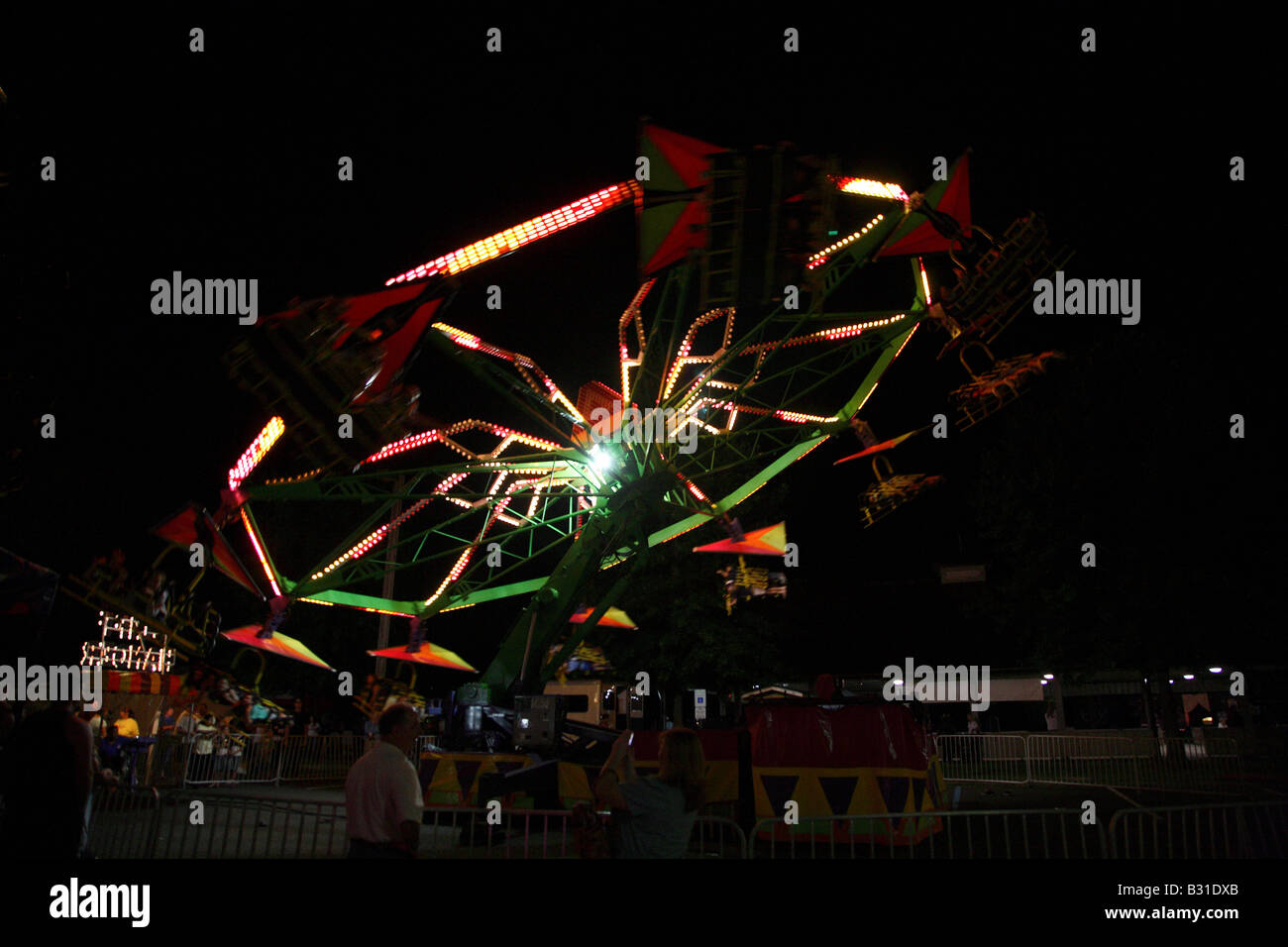 Chairoplane flying whirl. Up at 45 degree angle. Bands of revolving ...