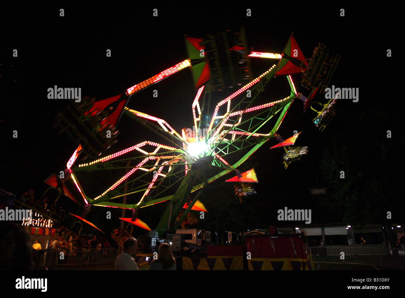 Chairoplane flying whirl. Up at 45 degree angle. Bands of revolving ...